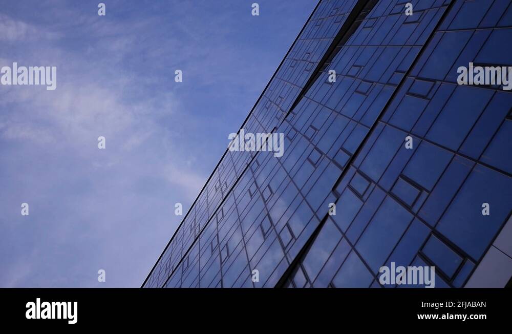 Reflected reflection in windows of office building block Stock Videos ...