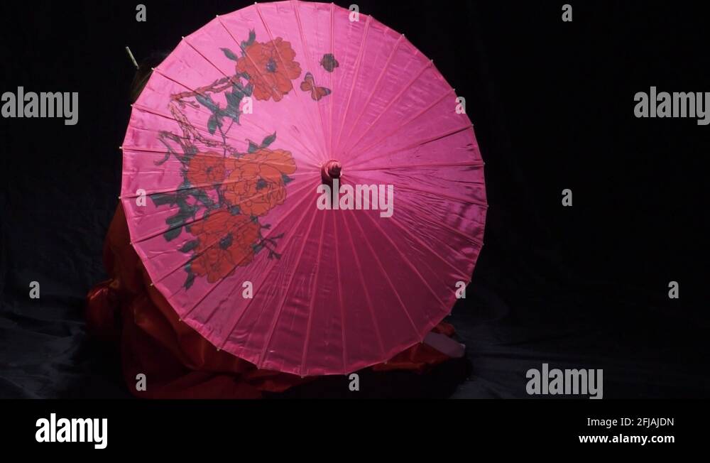Cute japanese woman hides behind an umbrella then puts it on her ...