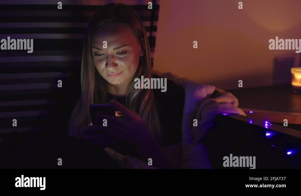 Young teen girl is having fun watching funny internet memes on her ...