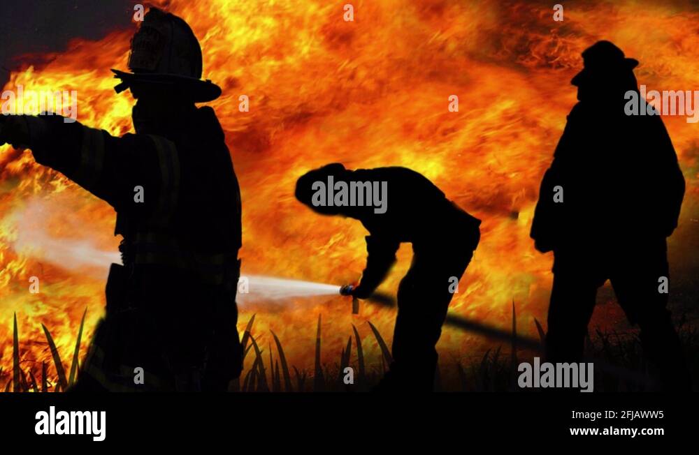Fireman silhouette raging forest fire at night cinemagraph plotagraph ...