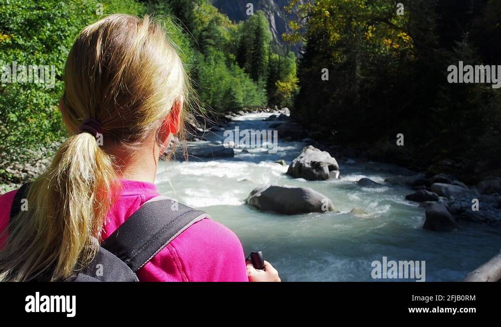 Girl Watching River Flowing Stock Video Footage - Alamy