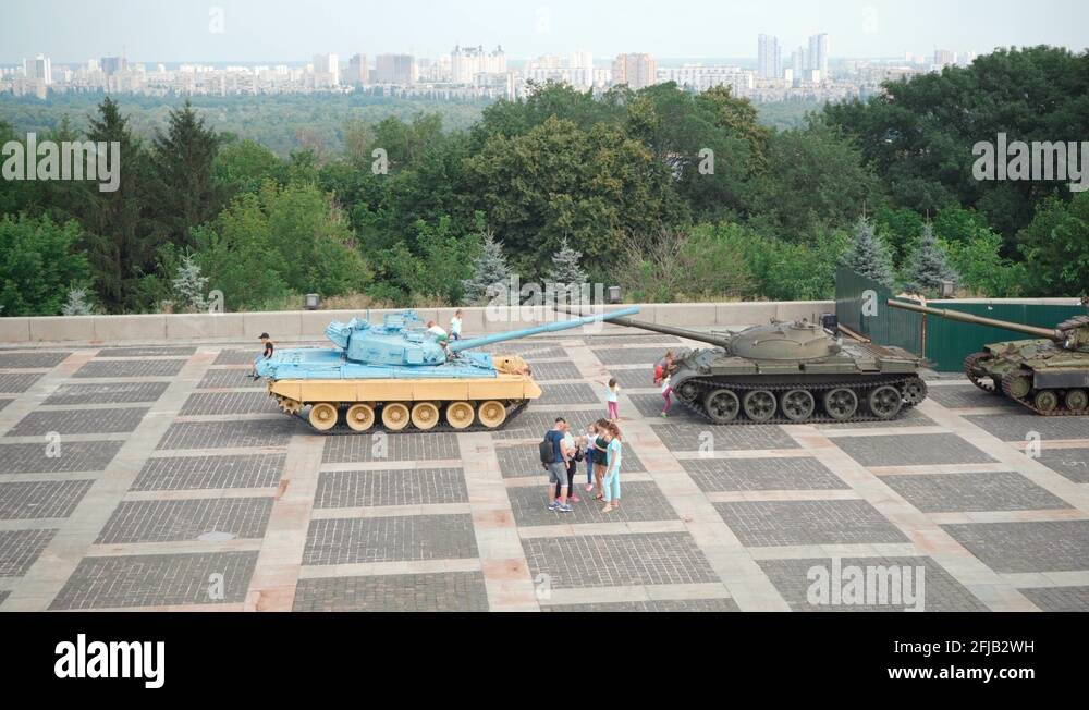 Children playing on tanks in war museum in Kiev, Ukraine. Symbol of war ...