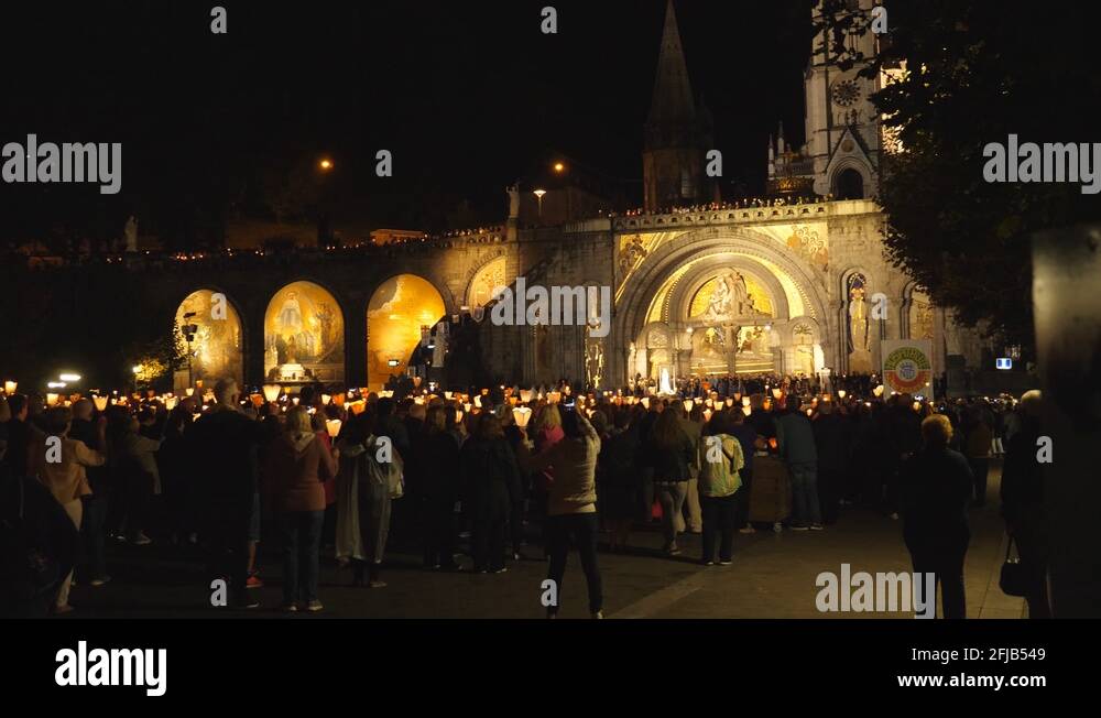 Candlelight procession of pilgrims at Rosary Basilica. Lourdes, France ...