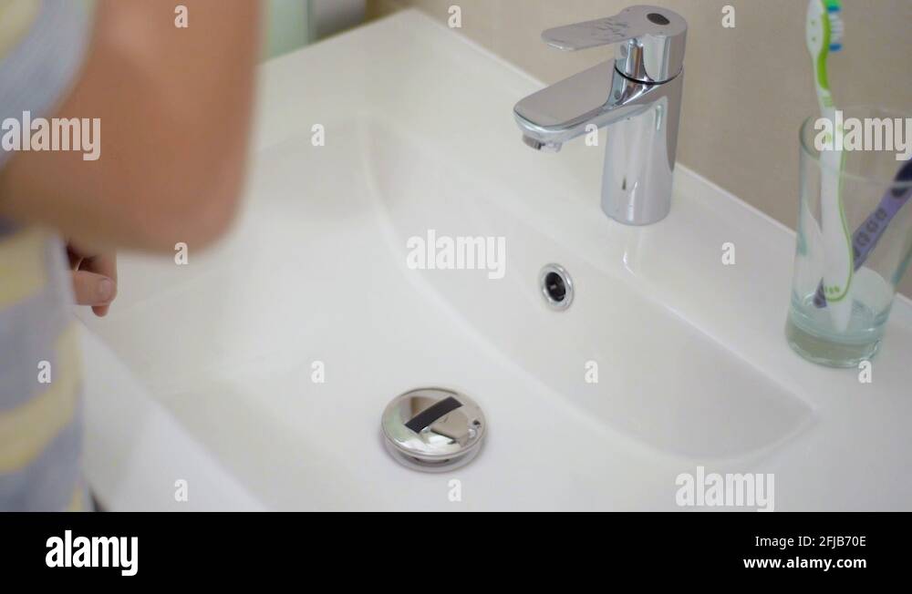 Teen boy brushing teeth Stock Video Footage - Alamy