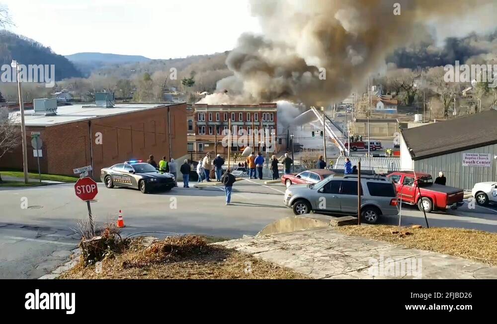 Downtown three story building on fire with firefighters on scene while ...