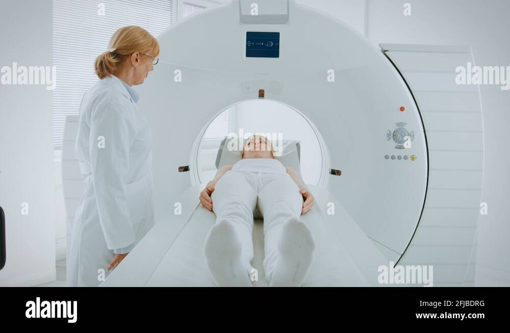 In Medical Laboratory Female Radiologist Controls MRI Scan with Female ...