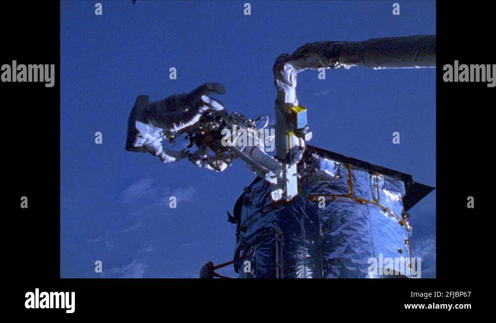 NASA astronauts works on Hubble Space Telescope - 1990 Stock Video ...