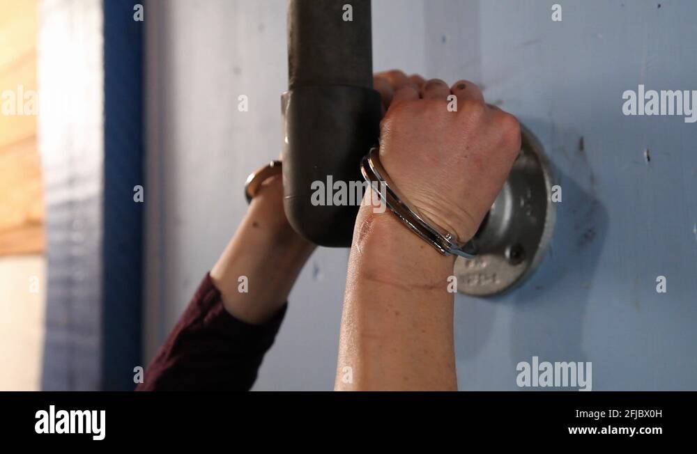 Handcuffed hands Stock Videos & Footage - HD and 4K Video Clips - Alamy