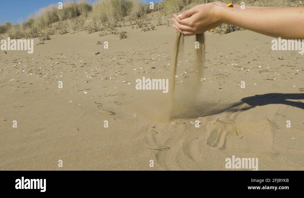 Sand falling through hand Stock Videos & Footage - HD and 4K Video ...