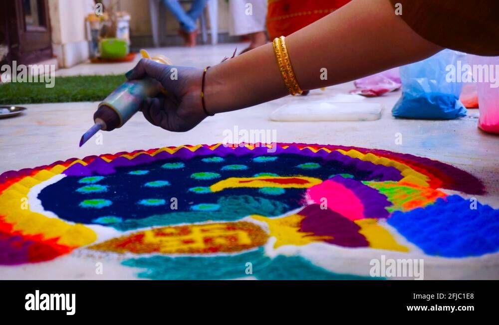 Girl hands using funnel cone to create rangoli on diwali Stock Video ...