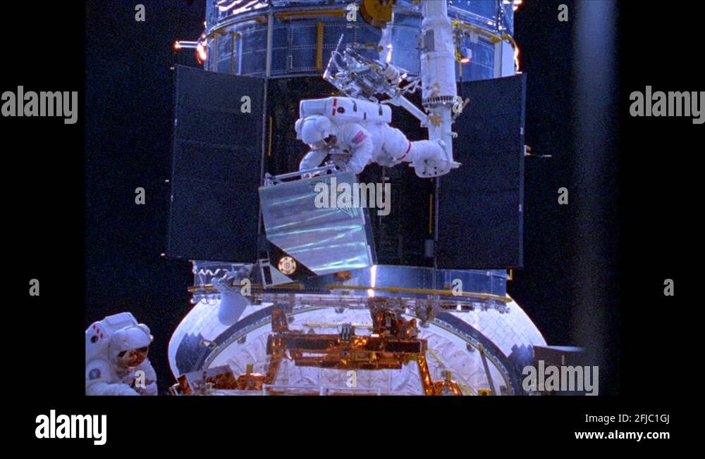 NASA astronauts works on Hubble Space Telescope - 1990 Stock Video ...