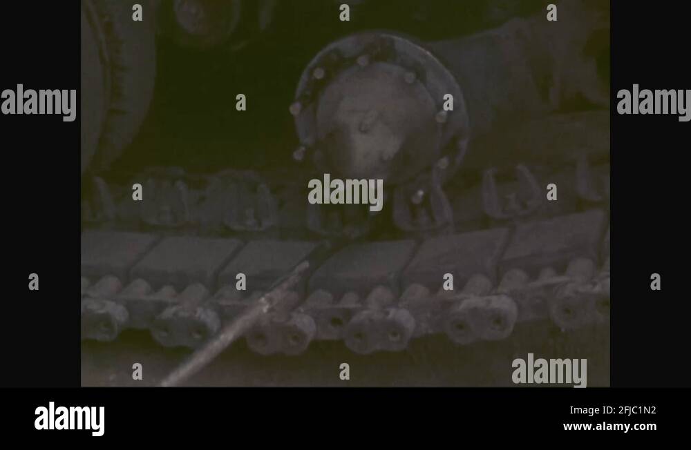 Scenes of soldier checks greasing tracks of tanks and tanks in row ...