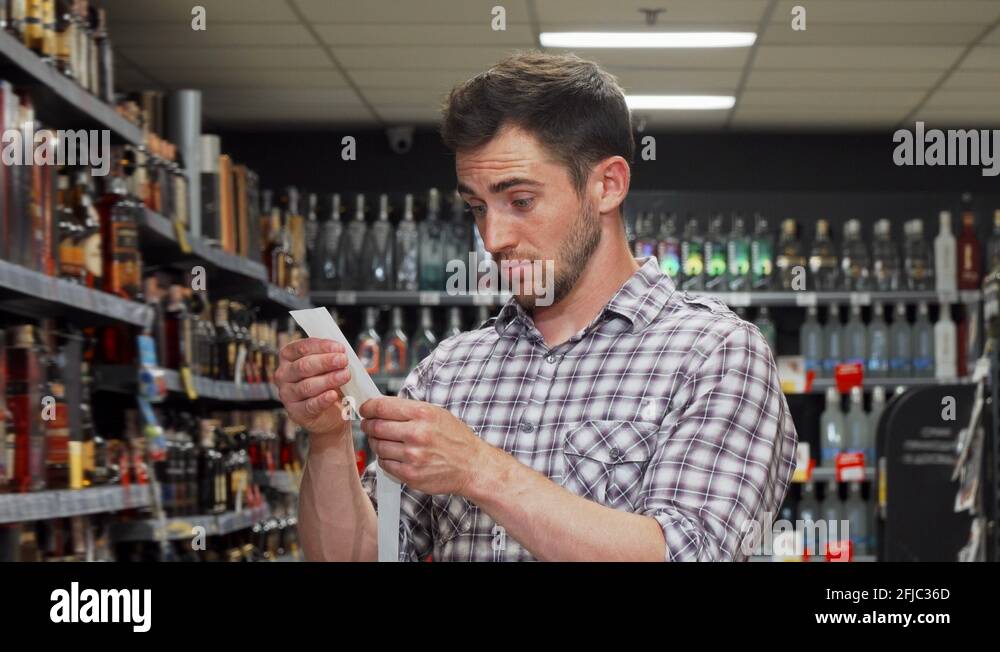 Man Looks Devastated After Paying Shopping Bill At The Supermarket Man Looks Devastated After Paying Shopping Bill At The Supermarket