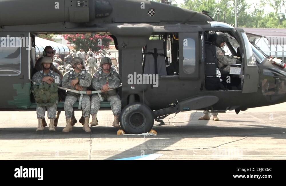 U.S. soldiers perform static line jump from a Black Hawk UH-60 ...