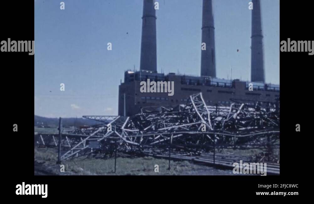 Scene of wrecked steel girders and destroyed power lines at power ...