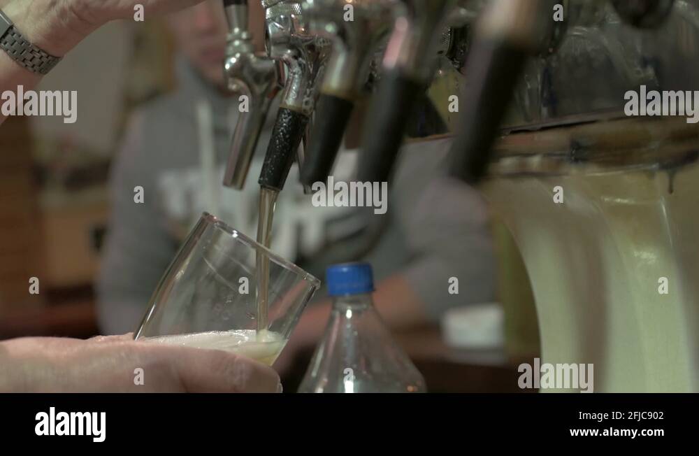 tapping beer in a pub Stock Video Footage - Alamy