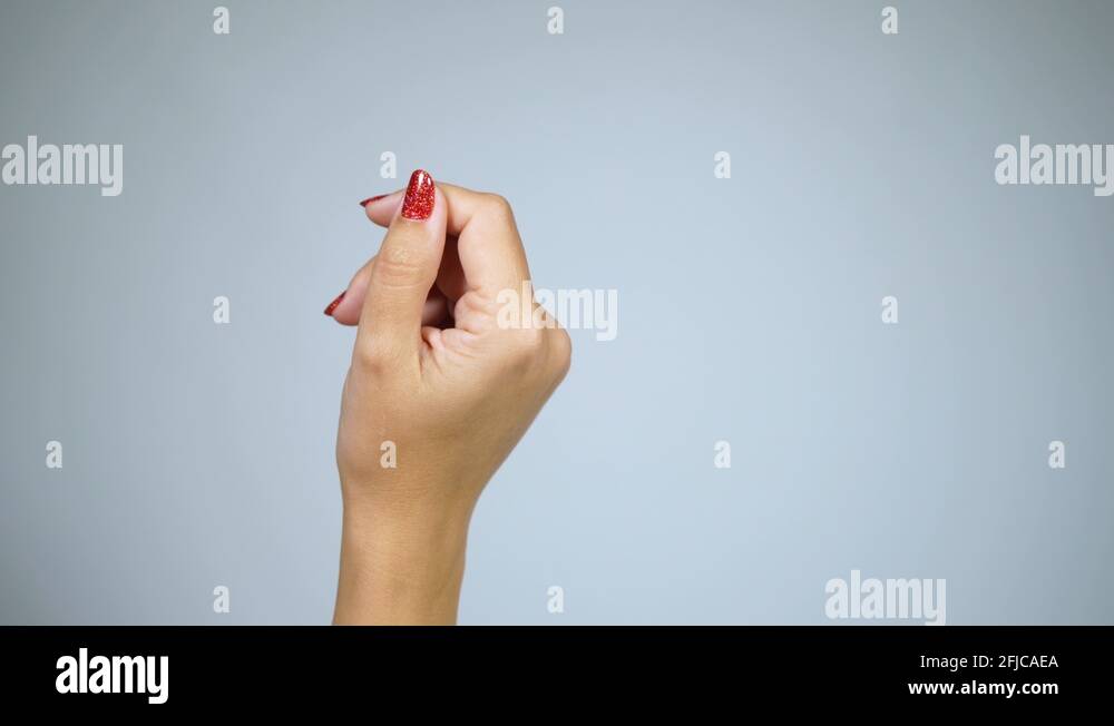 female hand raising up as if holding something virtual and invisible ...