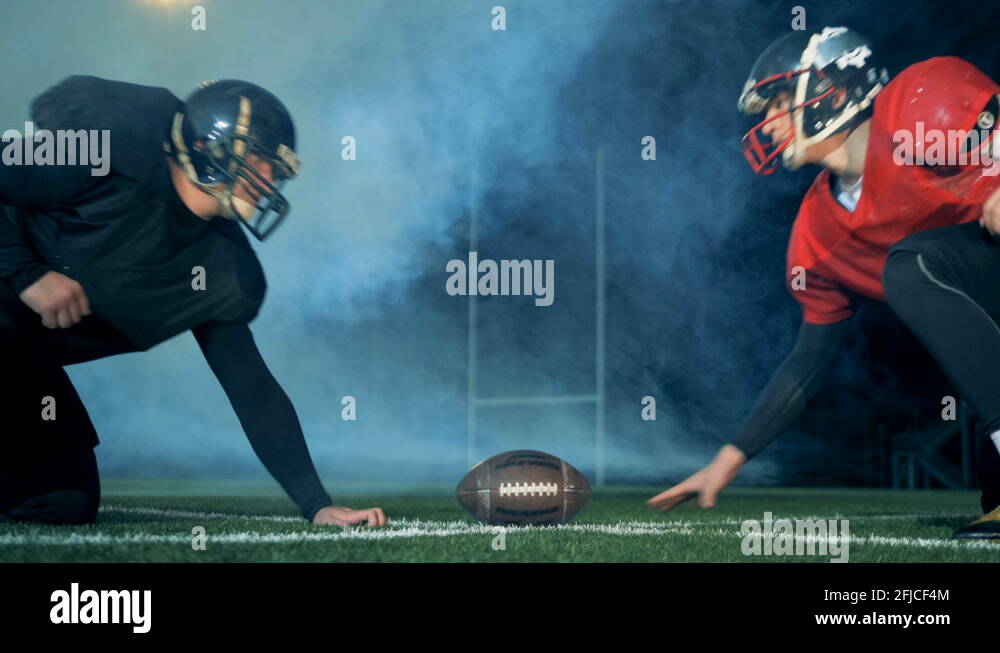 Two footballers are freezing in front of each other while playing ...