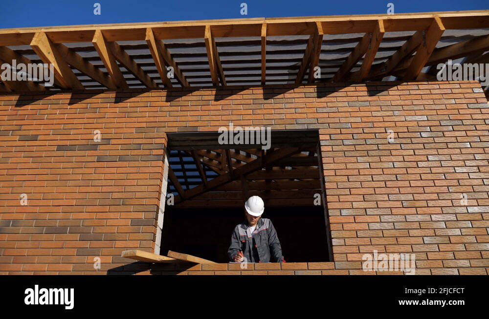 Man in window of building house Stock Video Footage - Alamy