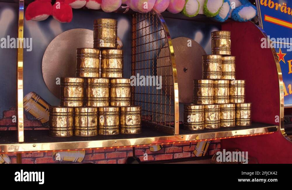 Knocking over cans with ball in carnival game 4k Stock Video Footage ...