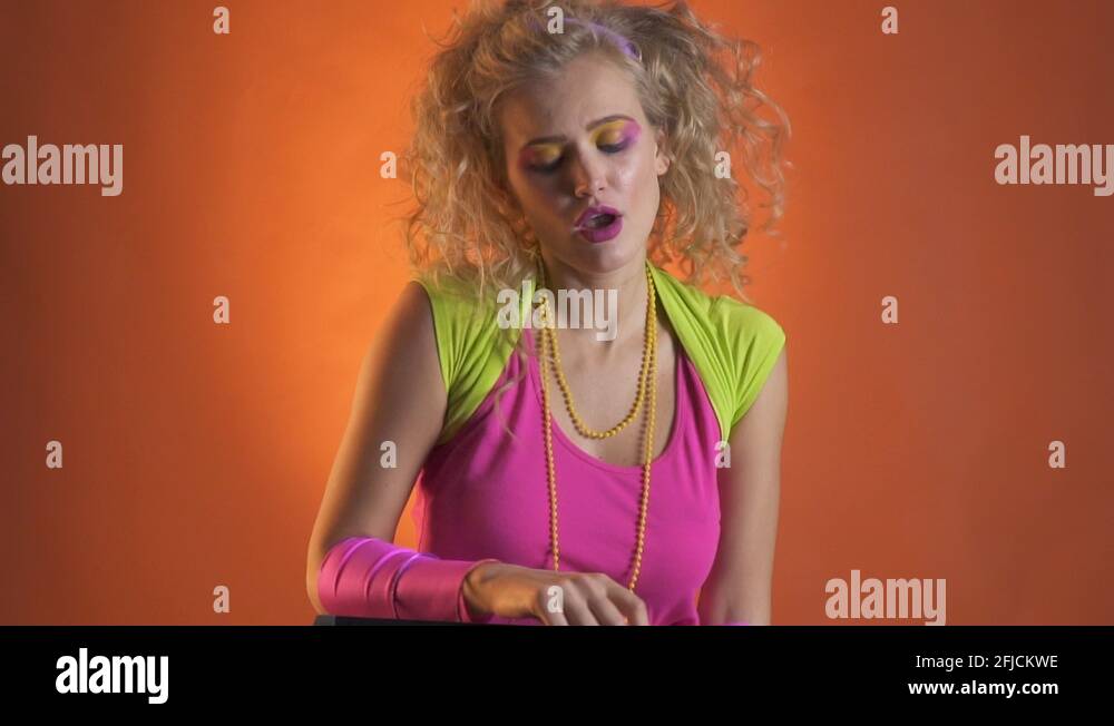 Woman in retro outfit puts a boombox on her shoulder and poses Stock ...