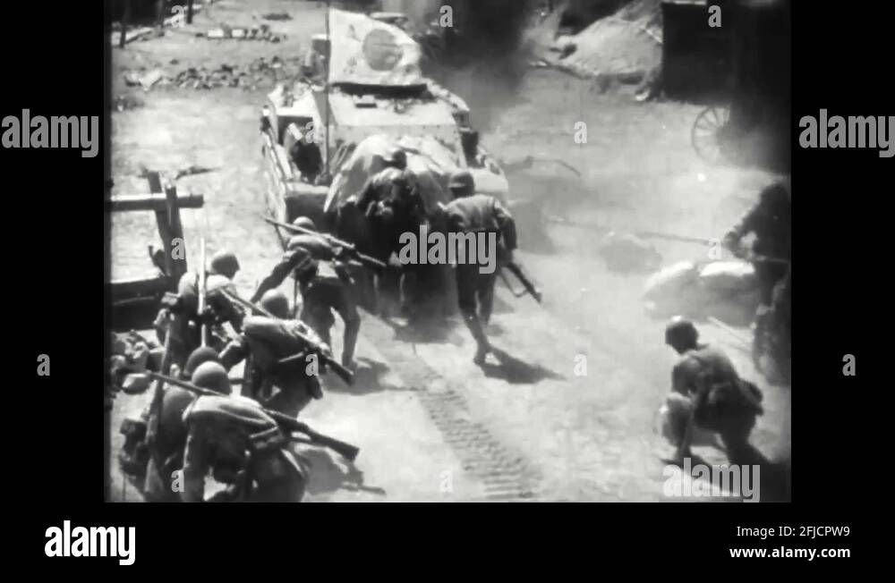 WW2 Japan - Soldiers walk behind a tank into a battle Stock Video ...