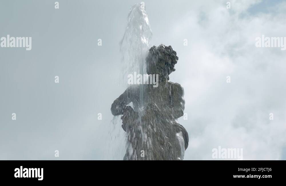 fountain flow is pouring from statue of human, ancient architectural ...