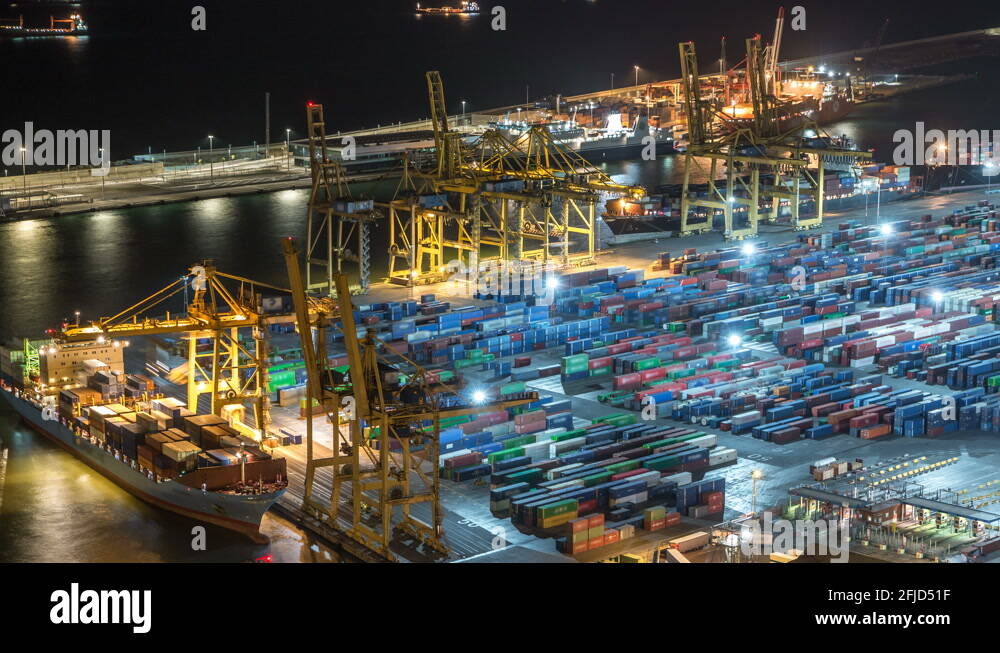 Seaport and loading docks at the port with cranes and multi-colored ...