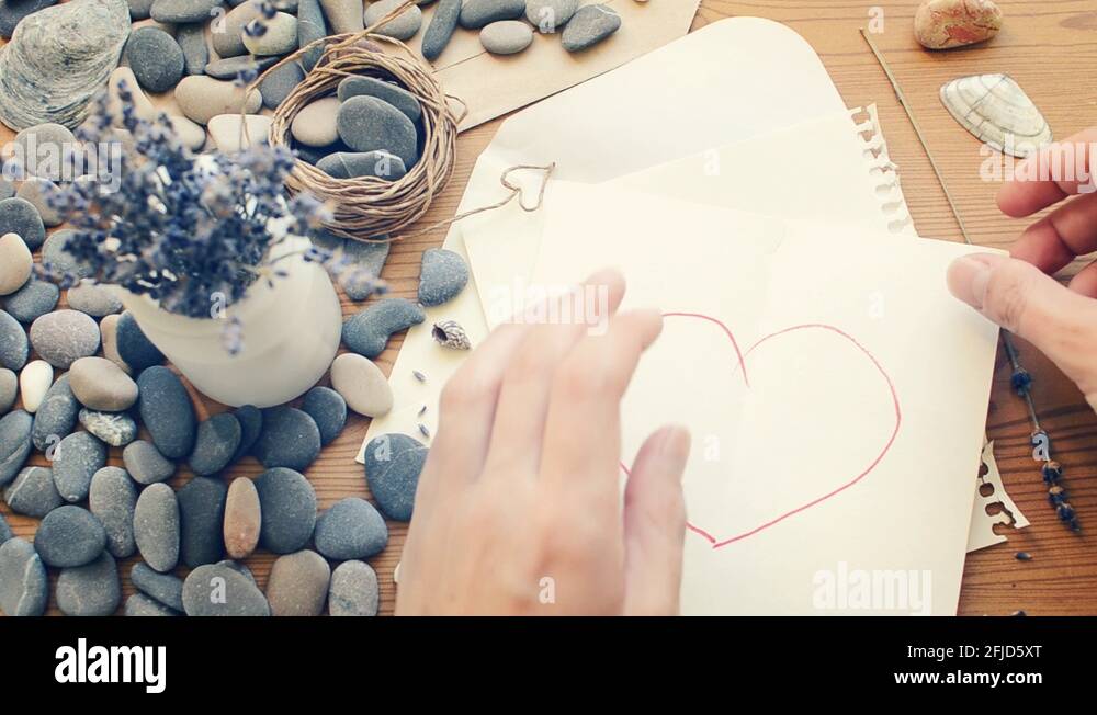 Hands tearing a heart in half. The end of the relationship Stock Video ...