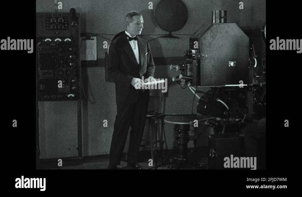 Edward Craft demonstrates the equipment of the projection booth - 1926 ...