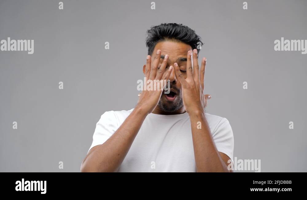 shocked indian man over grey background Stock Video Footage - Alamy