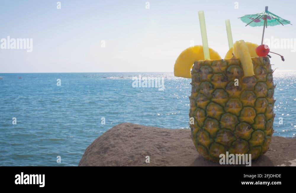 Piña Colada Served in a Fresh Pineapple at a Beach Resort in 4k Stock ...