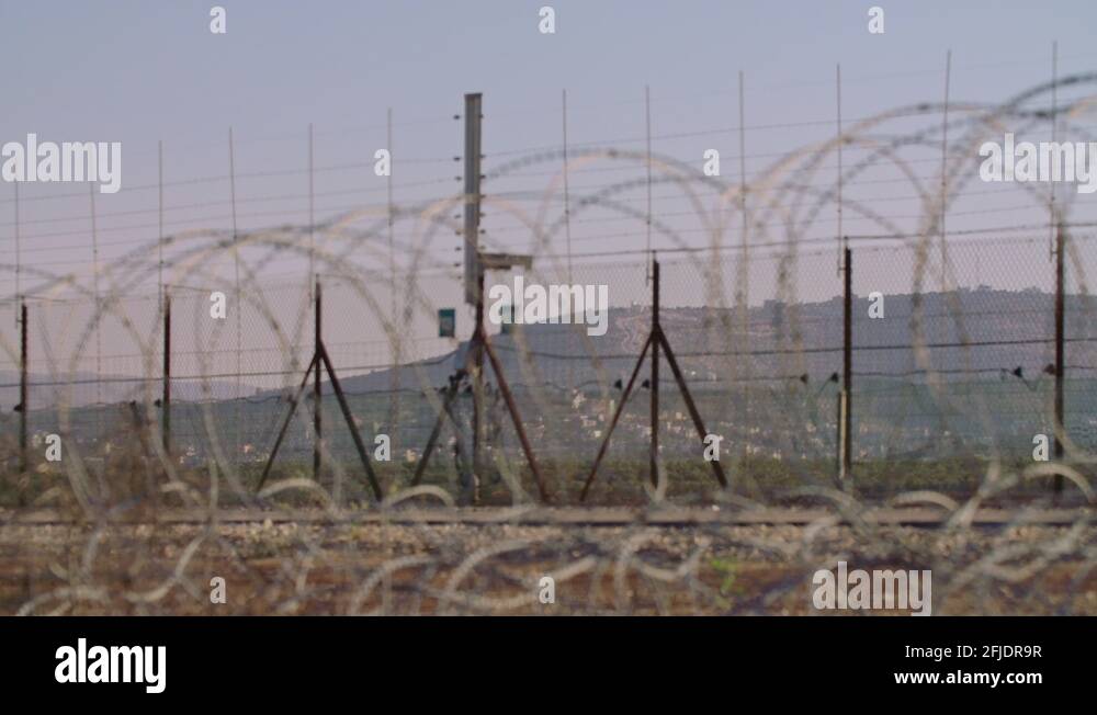 Border fence between Israel and West Bank. barbed wire electronic fence ...