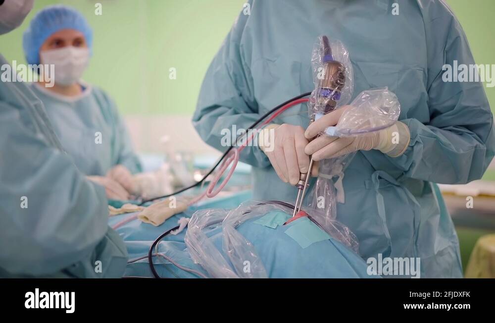 doctor is inputting long tools and cameras inside a nasal cavity of ...