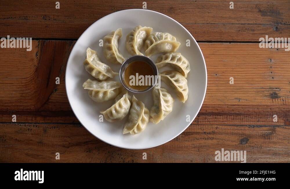 Eating Nepalese Traditional Dish Momo. Authentic Cuisine in Nepal Stock ...
