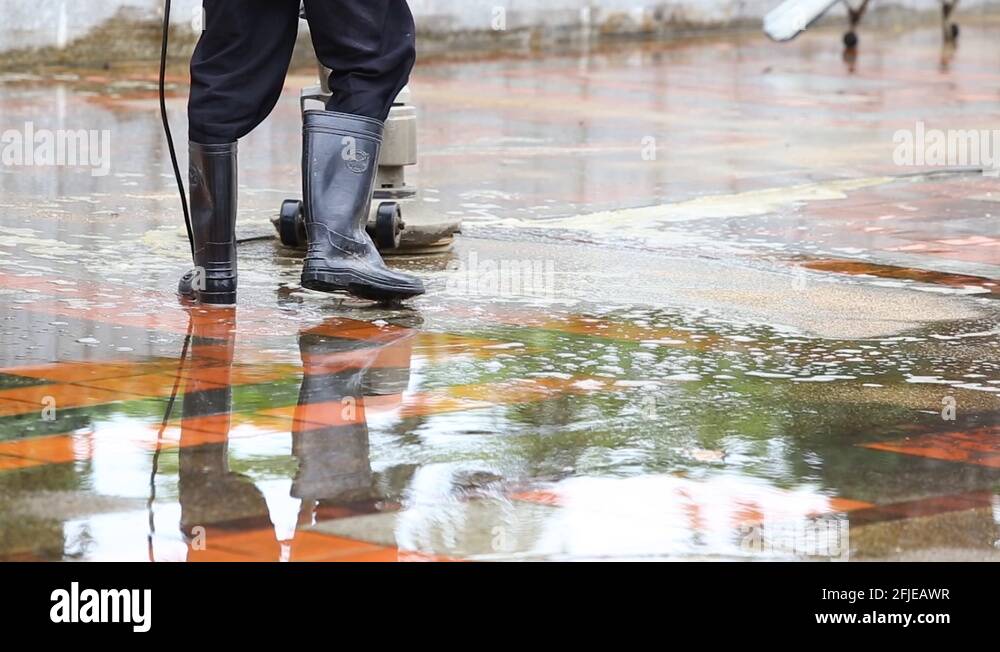 Labor cleaning the floor with industrial floor cleaning machine Stock ...