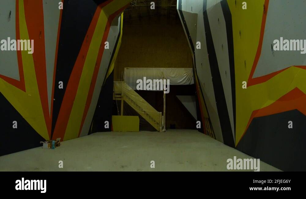 Camera tilt up in a climbing area with artificial walls under ...