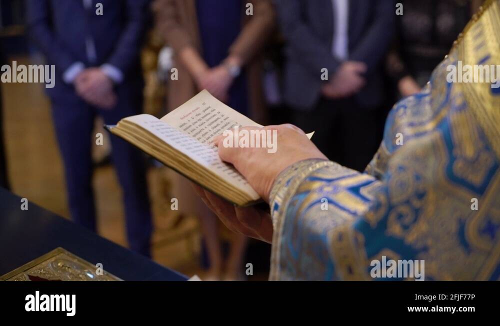 Priest praying with Bible book in church Stock Video Footage - Alamy