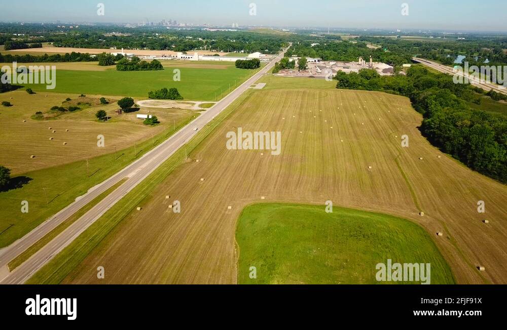 Reverse view of a small mound sour rounded by Haystacks and a view of ...