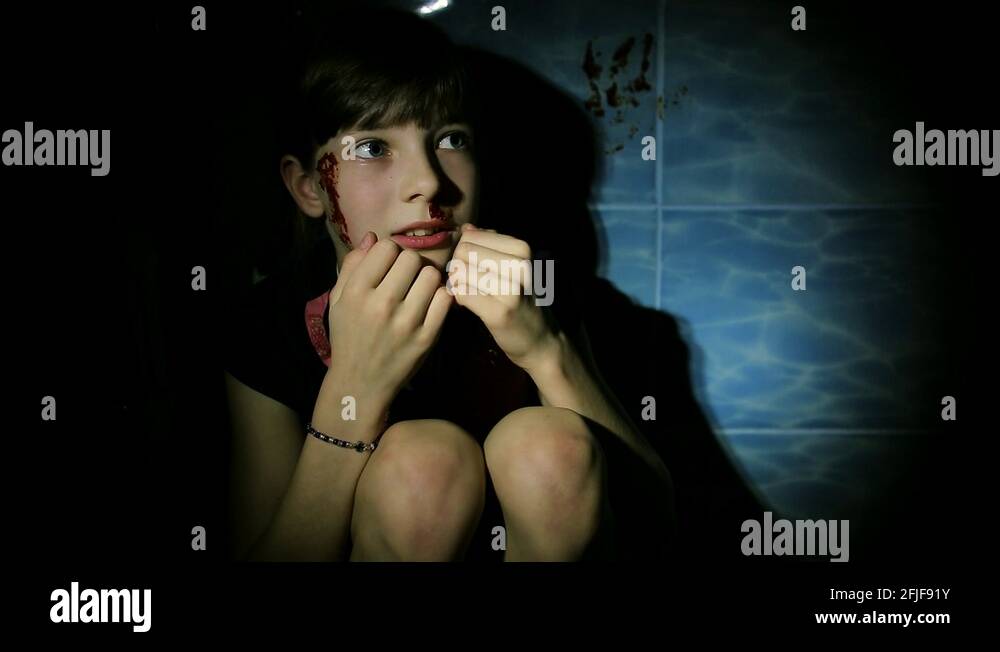 teen girl with blood on her face hiding in bathroom, domestic violence ...
