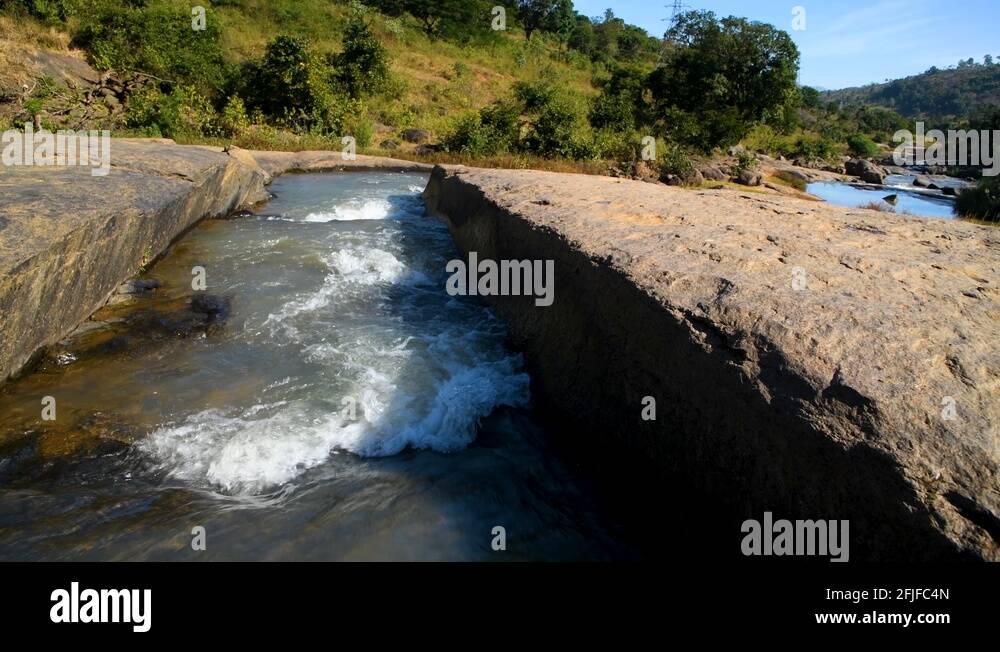 Water flow from rocks water flow trees green Stock Videos & Footage ...