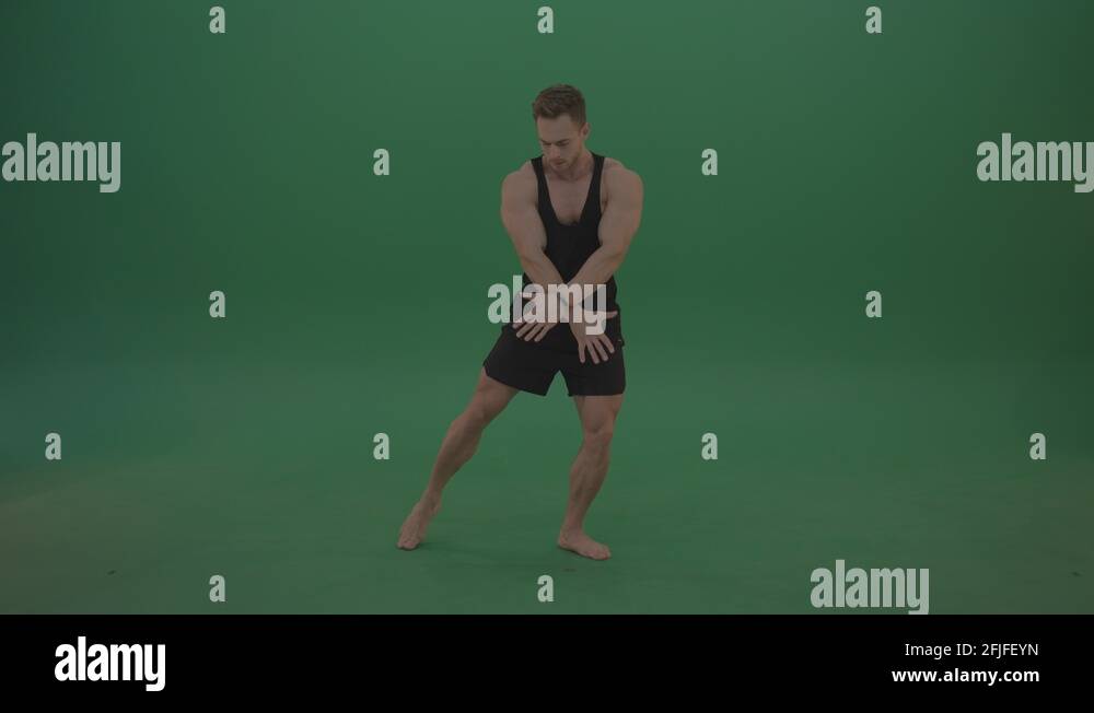 Green Screen Man Bodybilder shows arms muscules and biceps on green ...