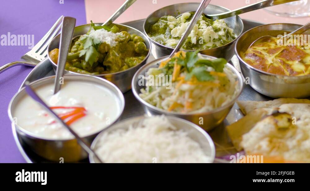 Gujarati north indian food cuisine thali on a small steel platter, with ...
