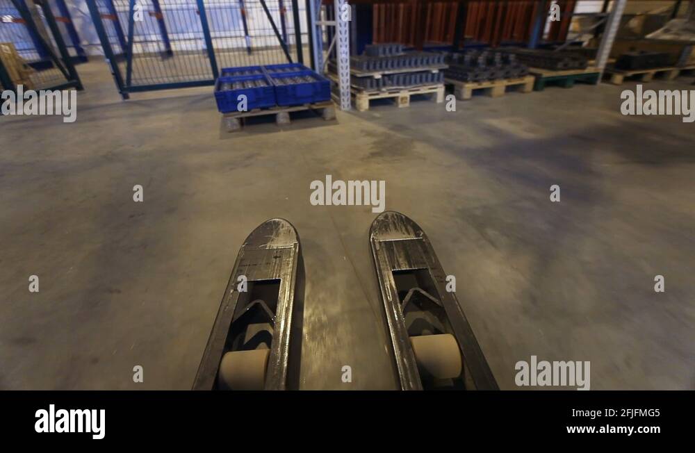 Top view of forklift truck going to load boxes with metal billets ...