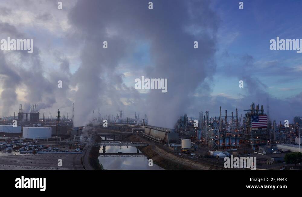 US flag hanging at Tesoro oil refinery, Carson, Los Angeles, California ...