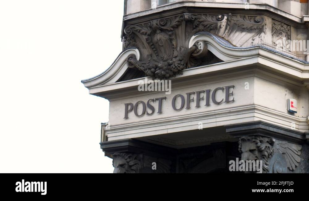 Close Up of a UK Post Office sign above the store front. This is the ...