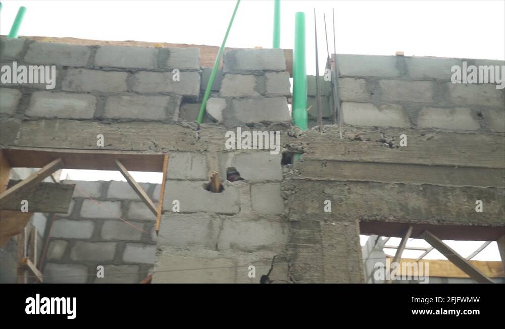 A modern brick house under construction, its at its brick laying stage ...