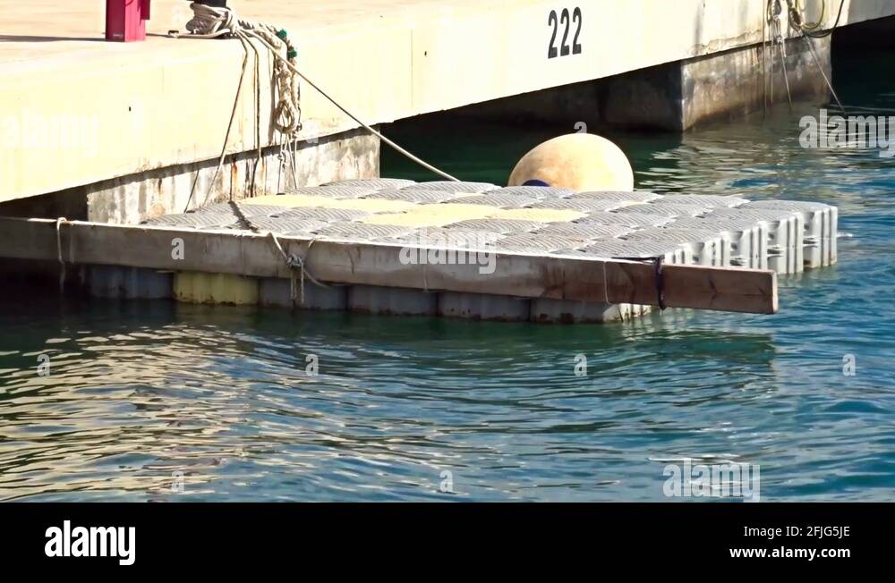 a Typical marina pier where boats can anchor Stock Video Footage - Alamy