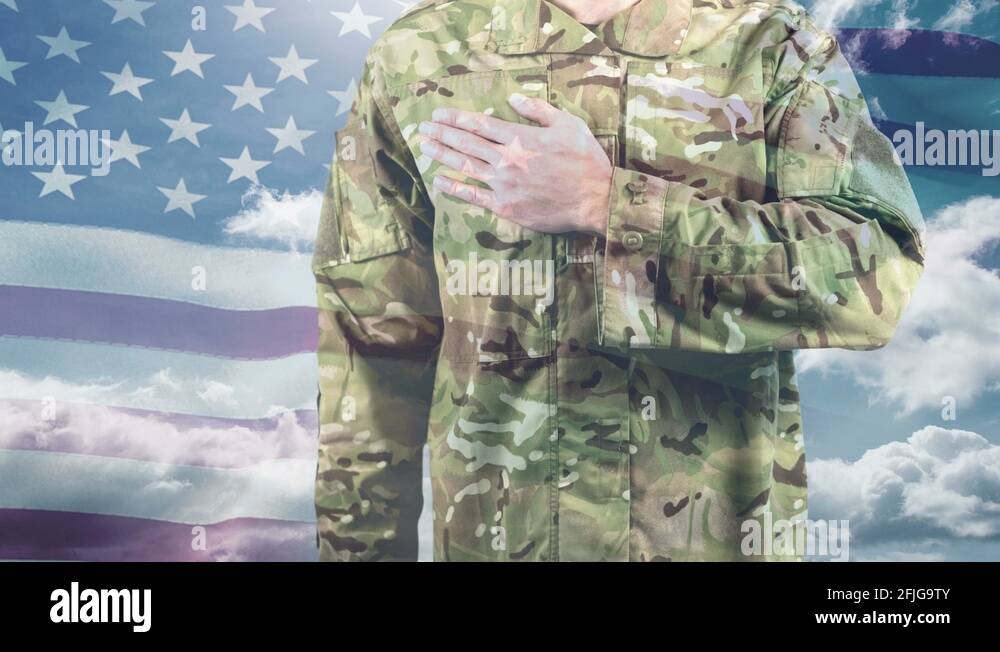 American soldier taking a pledge and American flag swaying in the ...