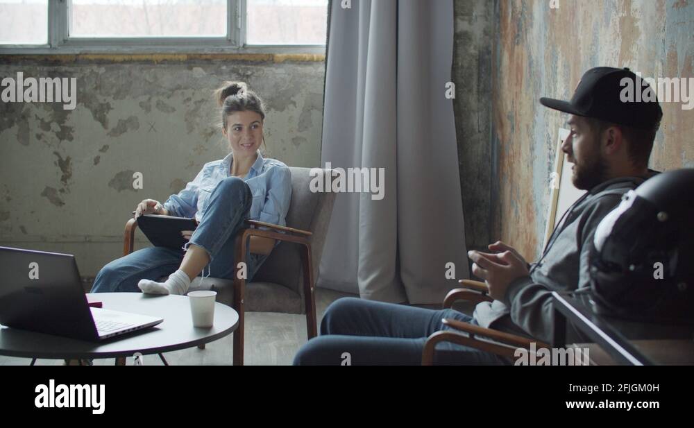 Two creative people working together in small office Stock Video ...